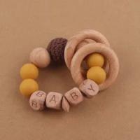 China Baby Teething Toys Rattle Soft Bpa Free Cartoon Wood Baby Teether Ring Kids Food Grade Baby Silicone Teether for sale