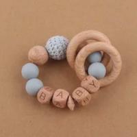 China Baby Teething Toys Rattle Soft Bpa Free Cartoon Wood Baby Teether Ring Kids Food Grade Baby Silicone Teether for sale
