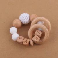 China Baby Teething Toys Rattle Soft Bpa Free Cartoon Wood Baby Teether Ring Kids Food Grade Baby Silicone Teether for sale