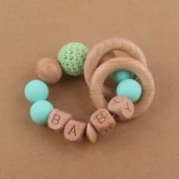 China Baby Teething Toys Rattle Soft Bpa Free Cartoon Wood Baby Teether Ring Kids Food Grade Baby Silicone Teether for sale