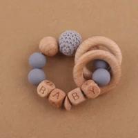 China Baby Teething Toys Rattle Soft Bpa Free Cartoon Wood Baby Teether Ring Kids Food Grade Baby Silicone Teether for sale