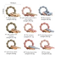 China BPA Free Infant Teething Toys Silicone Bracelet Pendant Wood Ring for sale