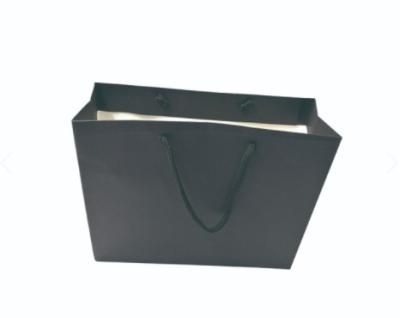 China Clothes Shopping Paper Packaging Bags Branded Paper Bag With String Handle for sale