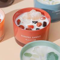 China Eco Friendly 65g Soy Wax With Stone Candles Amber Glass Candle for sale