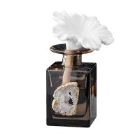 China Hotel Glass Bottle Oil Reed Diffuser Flameless Fragrance Fiber Rattan Stick Gold Metal Lid for sale