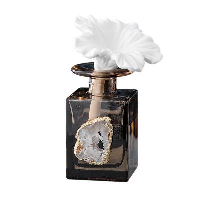 China Hotel Glass Bottle Oil Reed Diffuser Flameless Fragrance Fiber Rattan Stick Gold Metal Lid for sale