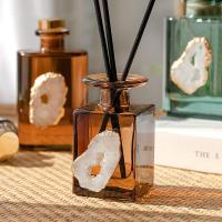 China Hotel Glass Bottle Oil Reed Diffuser Flameless Fragrance Fiber Rattan Stick Gold Metal Lid for sale