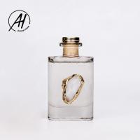 China Fiber Rattan Square Golden Lid Glass Bottle Essential Oil Aroma Reed Diffuser 180ML for sale