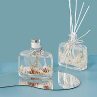 China Unique Bottles Gift Box Cover Container Ocean Scented Oil Glass Reed Diffuser for sale