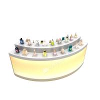 China Perfume Makeup Skincare Display Rack Display Showcase Curved Counter With Light for sale