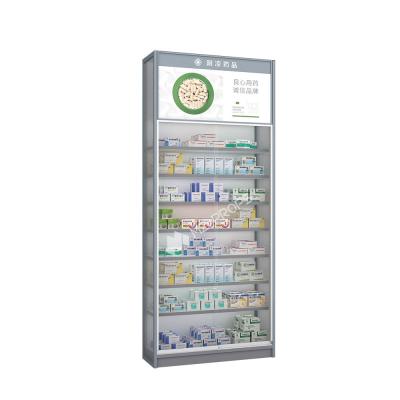 China OEM Medicine Store Pharmacy Shelving Systems Display Table Gondola for sale