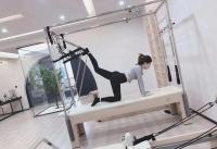 China Adjustable Springs Cadillac Reformer Pilates Equipment Suitable for Beginner To Advanced Pilates Practitioners Enhancing Flexibility Strength and Balance for sale