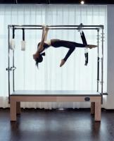 China Pilates Cadillac Reforming Equipment Providing Professional and Home Pilates Workouts with Easy Spring Adjustments for sale