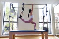 China Pilates Cadillac Reforming Equipment Providing Professional and Home Pilates Workouts with Easy Spring Adjustments for sale