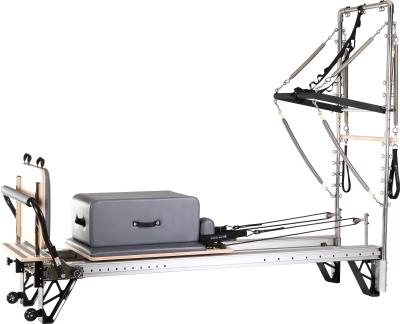 China Aluminum Pilates Reformer with tower featuring steel frame padded upholstery ideal for studio and gym for sale