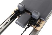 China Aluminum Pilates Reformer with tower featuring steel frame padded upholstery ideal for studio and gym for sale