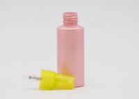 China Flat Shoulder Pink PET 50ml Small Plastic Spray Bottles Refillable With Yellow Pump for sale