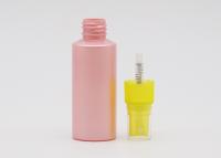 China Flat Shoulder Pink PET 50ml Small Plastic Spray Bottles Refillable With Yellow Pump for sale