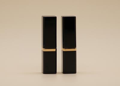 China Cuboid Black Lip Balm Tubes Screen Printing Surface Gold Aluminum Ring In Middle for sale