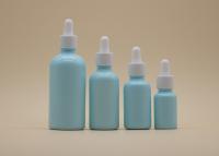 China Blue Coating Essential Oil Dropper Bottles White Ceramic Bottle For Personal Care for sale