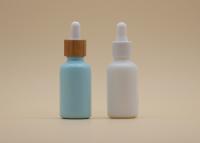 China Blue Coating Essential Oil Dropper Bottles White Ceramic Bottle For Personal Care for sale