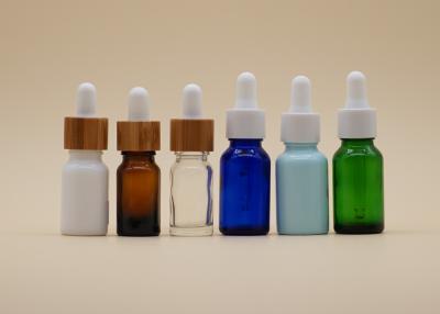 China Amber Empty Essential Oil Bottles Color Coating White Ceramic Dropper Bottle for sale