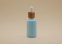 China Color Coating Sky Blue 15ml 30ml Essential Oil Bottles With Bamboo Dropper for sale