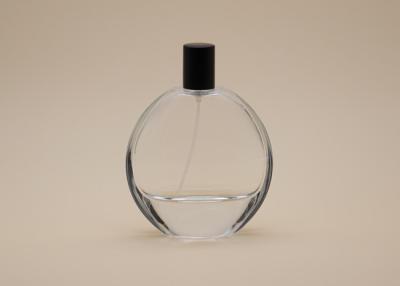 China Anti Spilling Glass Round Perfume Bottle 100ml Customized Surface Handing for sale