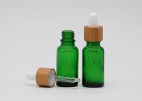 China Green Oil 18mm Cosmetic Glass Dropper Bottles With Bamboo Dropper Printing Pipette for sale
