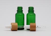 China Green Oil 18mm Cosmetic Glass Dropper Bottles With Bamboo Dropper Printing Pipette for sale