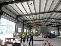 China Steel Structure Galvanized Warehouse With Electric Shutter Door for sale