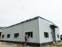 China Fireproof Steel Structure Building Warehouse with Electric Rolling Shutter Door 0.476mm Panel for sale
