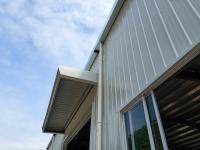 China Fireproof Steel Structure Building Warehouse with Electric Rolling Shutter Door 0.476mm Panel for sale