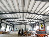 China Fireproof Steel Structure Building Warehouse with Electric Rolling Shutter Door 0.476mm Panel for sale
