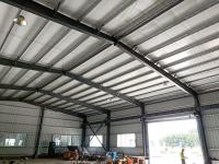 China Fireproof Steel Structure Building Warehouse with Electric Rolling Shutter Door 0.476mm Panel for sale