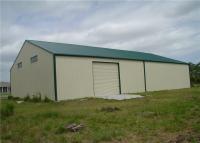 China Light Steel Frame Storage Building with Rolling Door 50mm Rock Wool Insulation for Commercial Use for sale