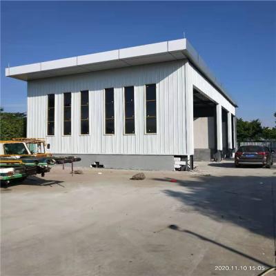 China Flat Roof Steel Structure Warehouse 50mm Sandwich Panel Ground Service Building for sale
