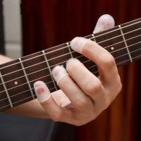 China Soft Silicone Guitar Finger Protector Sleeve Anti Pain for Guitar Ukulele 4 Pack for sale