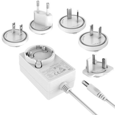 China 100%PC International Adapter with Interchangeable Plug 30W 36W AU US EU UK Stock 5V 9V 12V 24V 1.75A 3A Travel Adaptor DC for sale