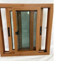 China Wood Grain Foil UPVC Double Sliding Windows Custom European Style for sale
