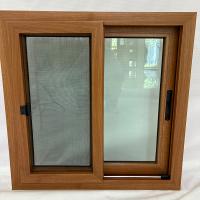 China UPVC Wood Foil Double Sliding Windows Custom European Style Energy Efficient for sale