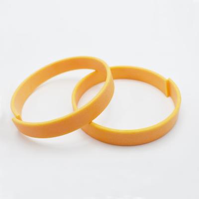 China Polyester Resin Wear Ring for Hydraulic Cylinders - Temperature -40°C to 250°C, Speed 0-15 m/s, Yellow Round Design for sale