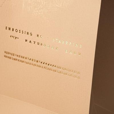 China Embossing Hot Stamping Eco-friendly Kraft Paper Bag Non Waterproof Durable Packaging Solution Perfect for Apparel and Gift Shops for sale
