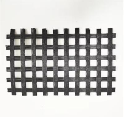 China 50-50KN/M Coated Bitumen Fiberglass Mesh Geogrid For Parking Lot Pavement Reinforcement for sale