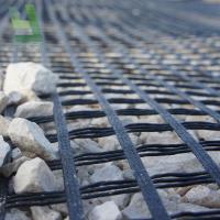 China 100KN/M UX Reinforce Polyester Geogrid for One Direction Reinforced Gravel Layer Isolation for sale