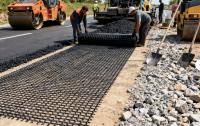 China Factory Price  150-150KN/M Biaxial Polyester Geogrid Mesh 50.8x50.8mm Road Soil Reinforcement for sale