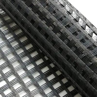 China Long Term Design Strength ASTM D6637  Polyester Geogrid 200-50KN/M Reinforce Road Embankments Retaining Wall for sale
