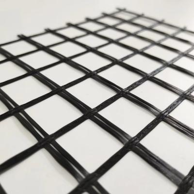 China Prevent Cracking Asphalt Driveway  Coated Bitumen  Fiberglass Geogrid 50 50 Grid Mesh 25.4mm for sale
