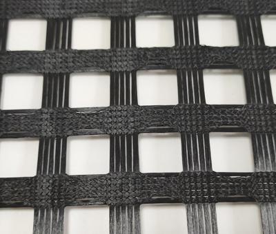 China Aperture Size 12.8mm Warp Knitted Fiberglass Biaxial Geogrid Tensile Strength 50/100 KN Base Reinforce Parking Lots for sale