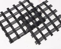 China Asphalt Reinforcement Bitumen Coated Fiberglass Biaxial Geogrid Landfill And Embankment Support for sale